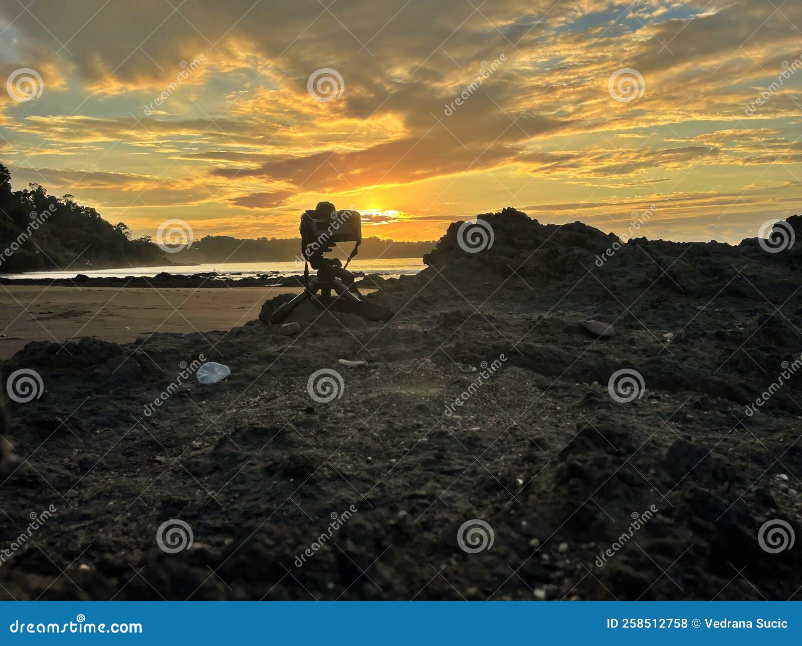 Camera on the Rock Shooting Sunset Stock Photo - Image of scenery ...
