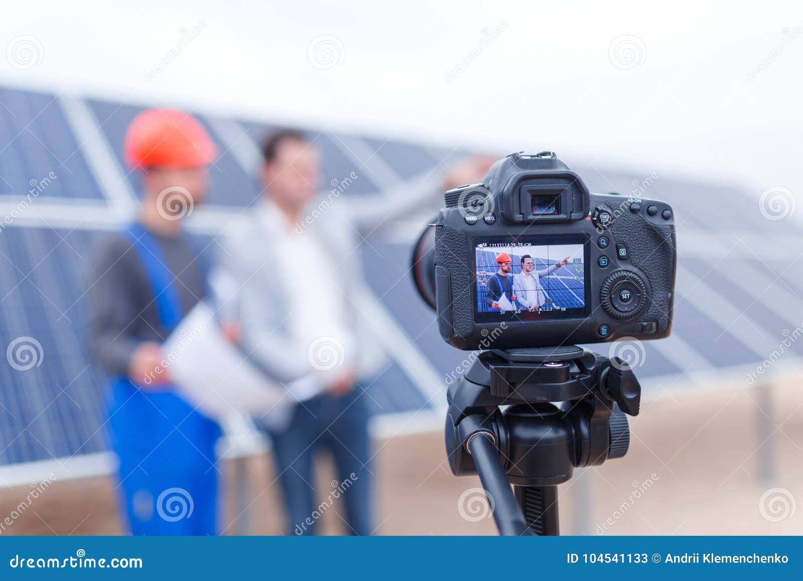 The Camera Shoots the Worker and the Head of the Solar Panels Stock ...