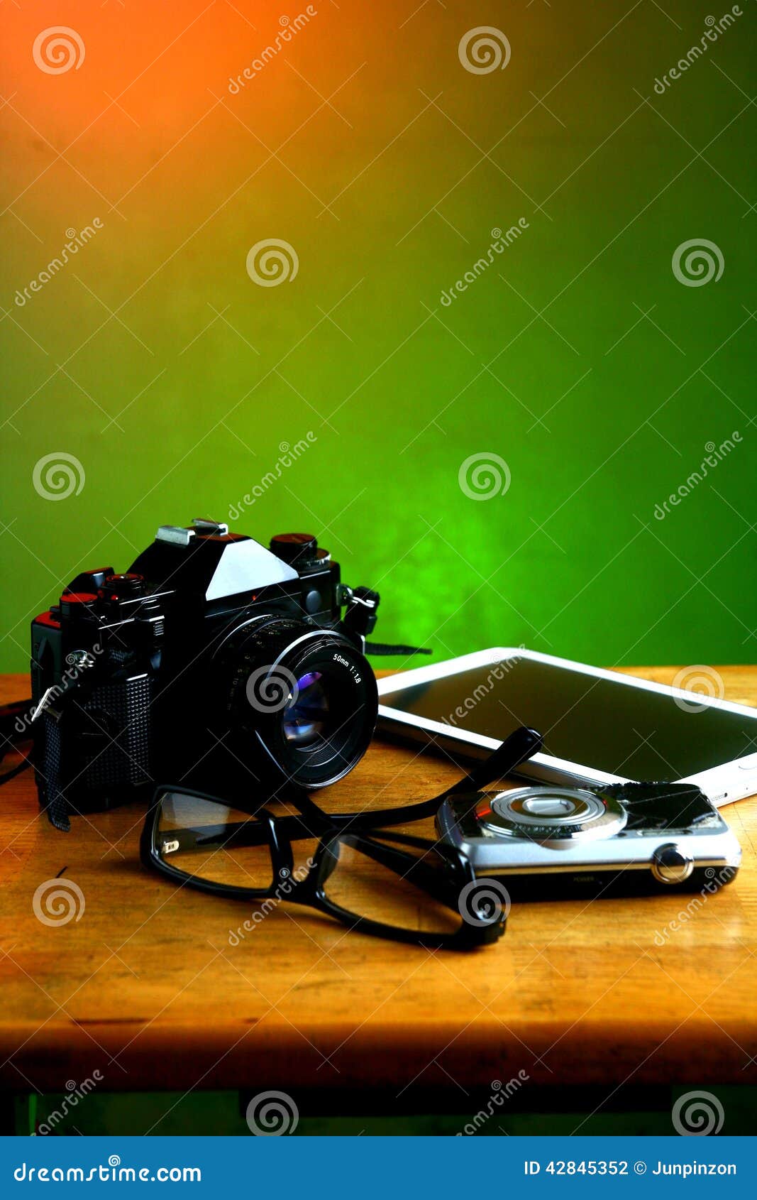 Camera, Tablet and Eyeglasses Stock Photo - Image of electrical, dslr ...