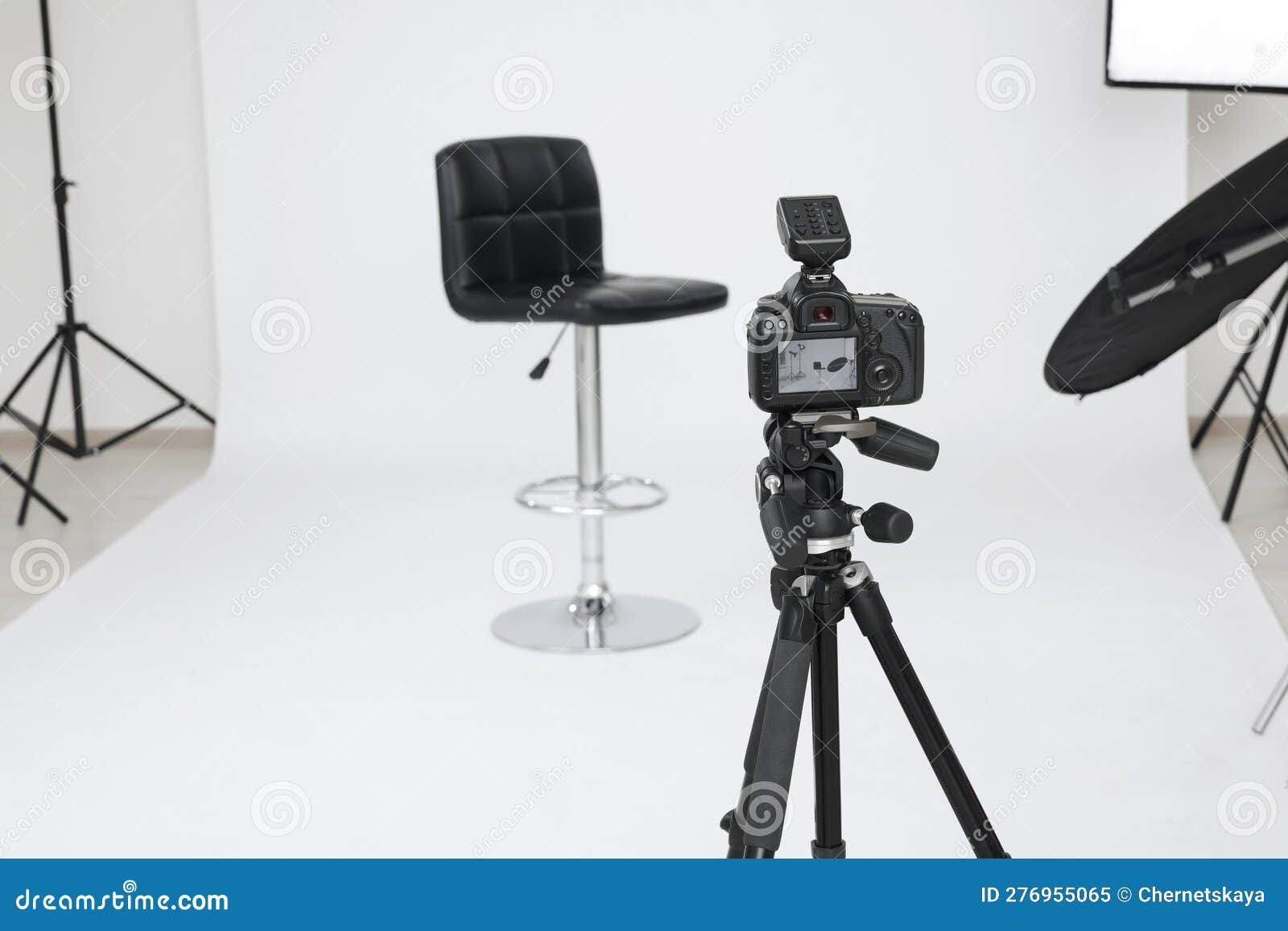 Camera on Tripod, Bar Stool and Professional Lighting Equipment in ...