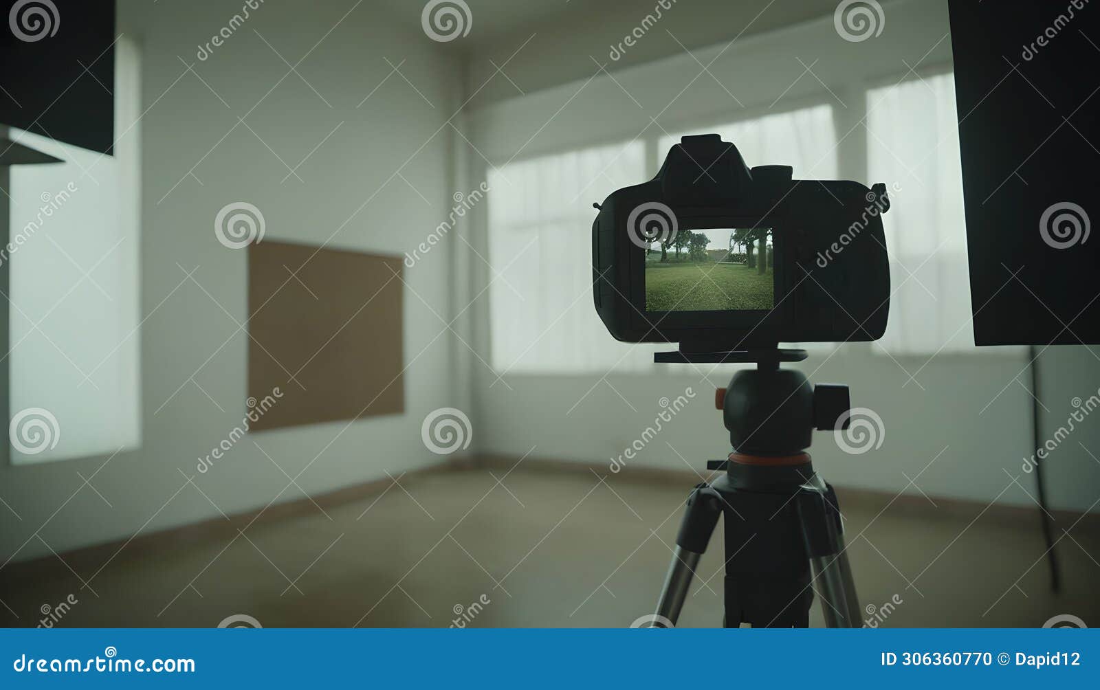 A Camera is on a Tripod in a Room, Ready for Action and Recording Stock ...