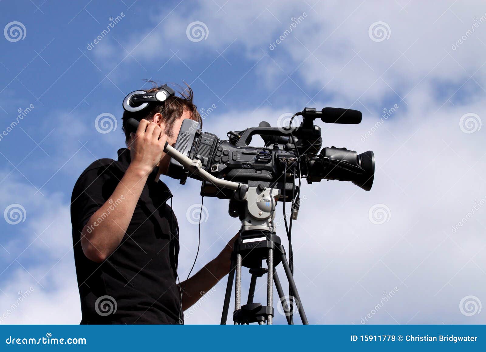 Cameraman filming editorial stock photo. Image of microphone - 15911778
