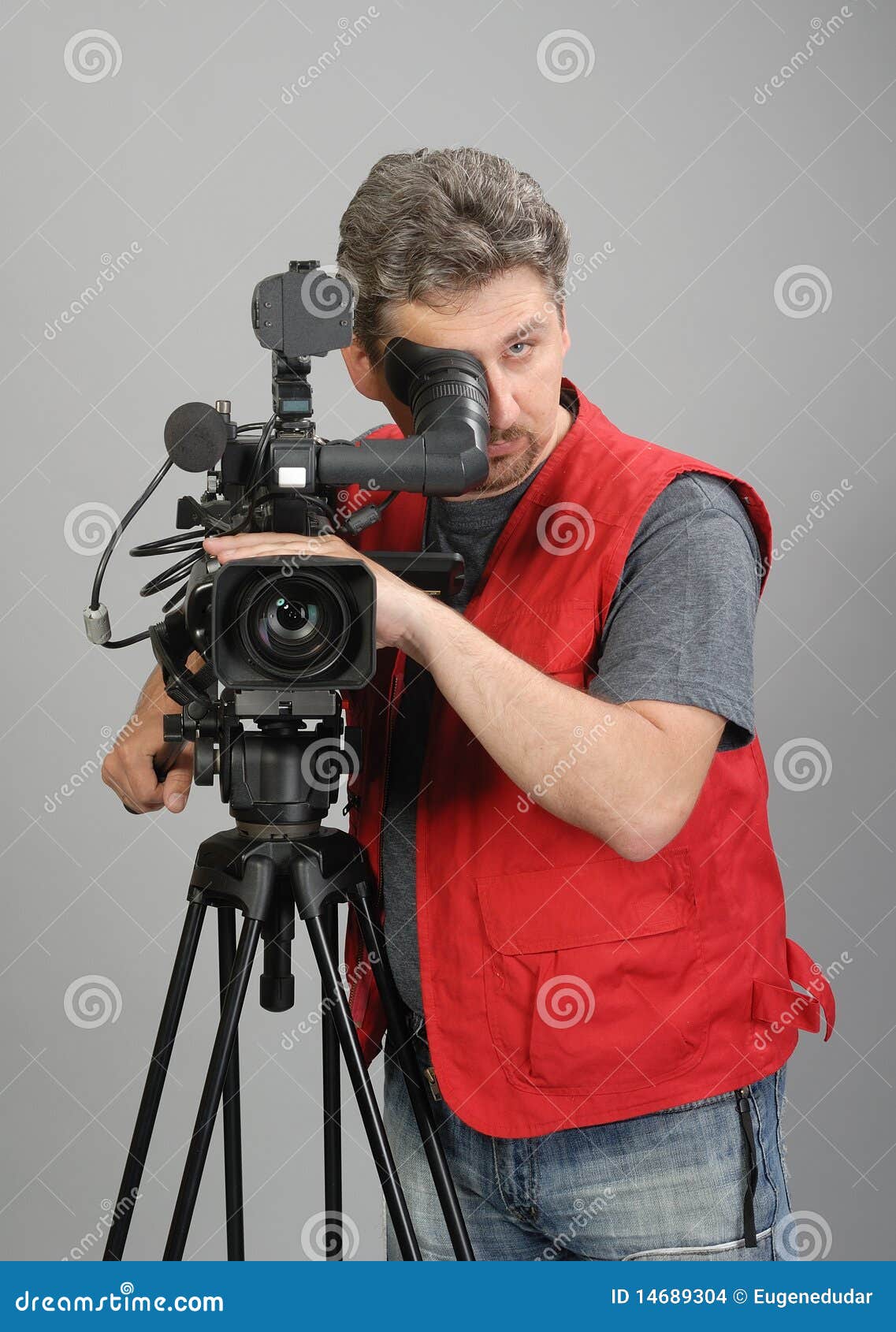 Cameraman in red vest stock photo. Image of skill, video - 14689304