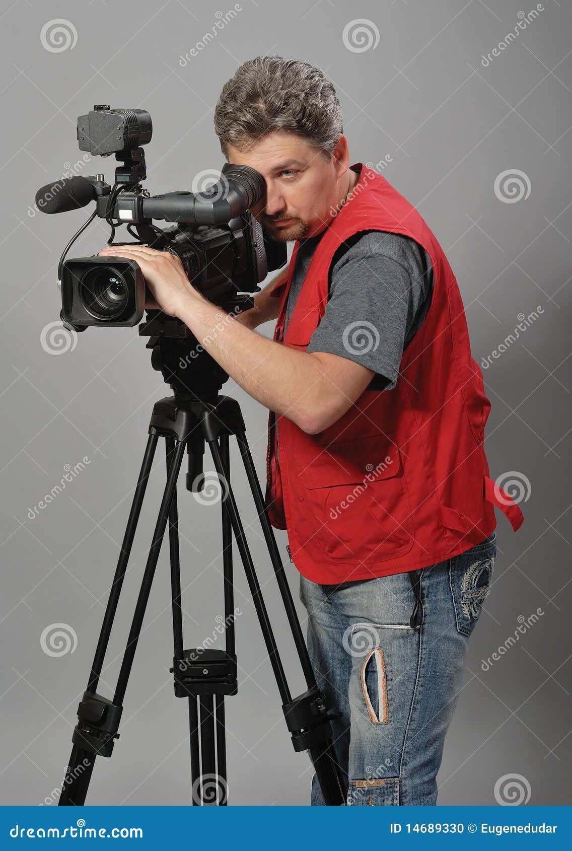 Cameraman in red vest stock photo. Image of television - 14689330