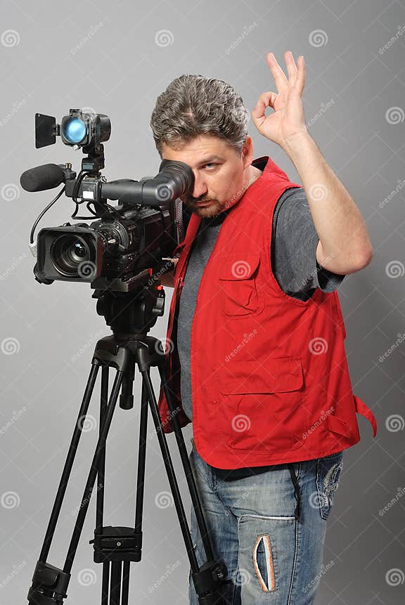 Cameraman in red vest stock image. Image of isolated - 14689411