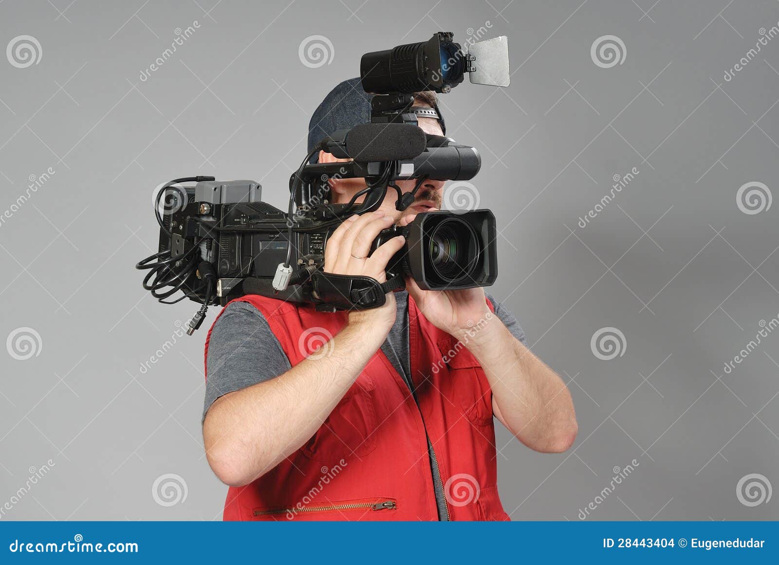 Cameraman in red vest stock photo. Image of camera, studio - 28443404