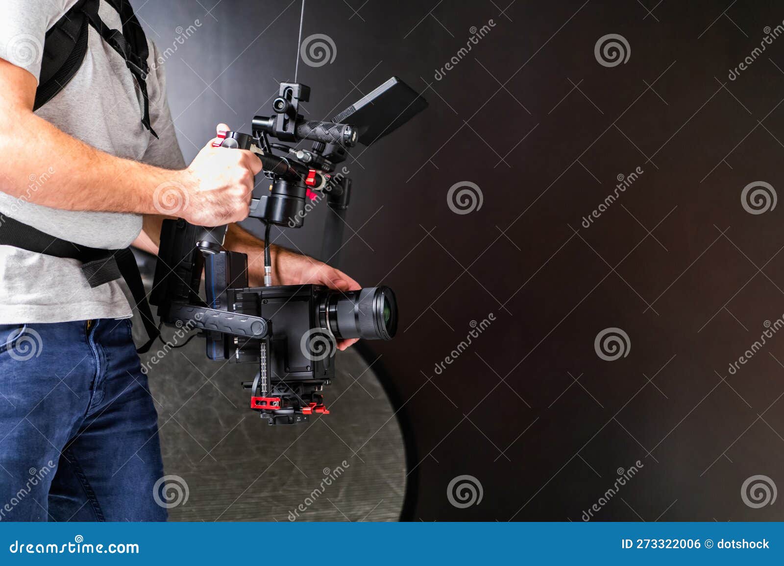 The Cameraman in the Studio Using a Professional Camera with a ...