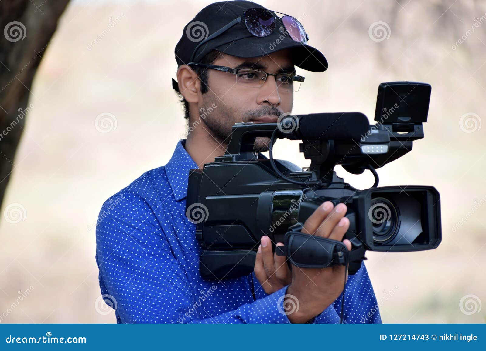 Cameraman Using a Professional Camcorder Outdoor Stock Image - Image of ...