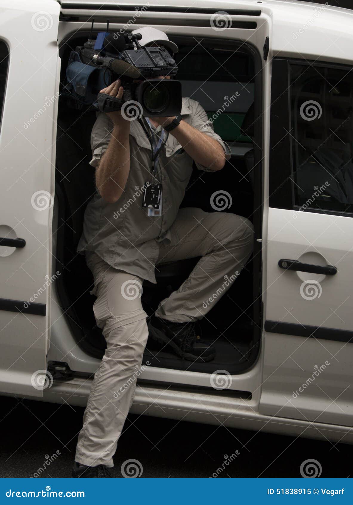 Cameraman in van editorial image. Image of device, press - 51838915