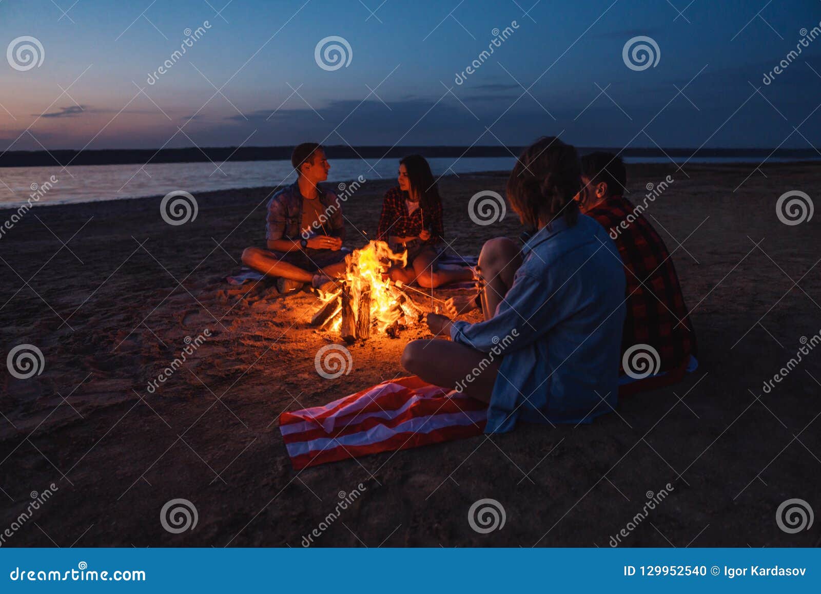 Young Friends Have Picnic with Bonfire on the Beach Stock Photo - Image ...