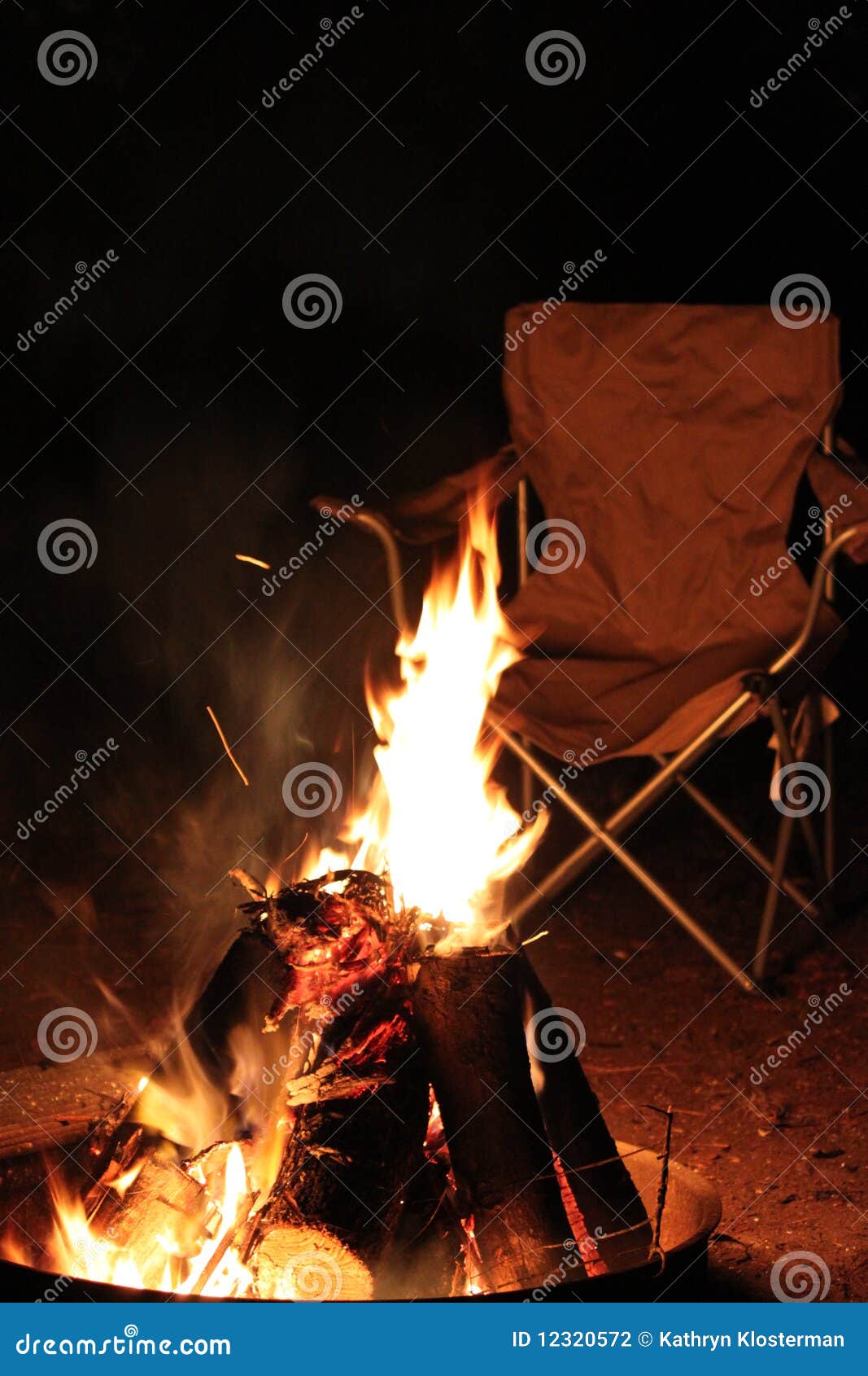 Camp fire at night stock photo. Image of seating, campsite - 12320572