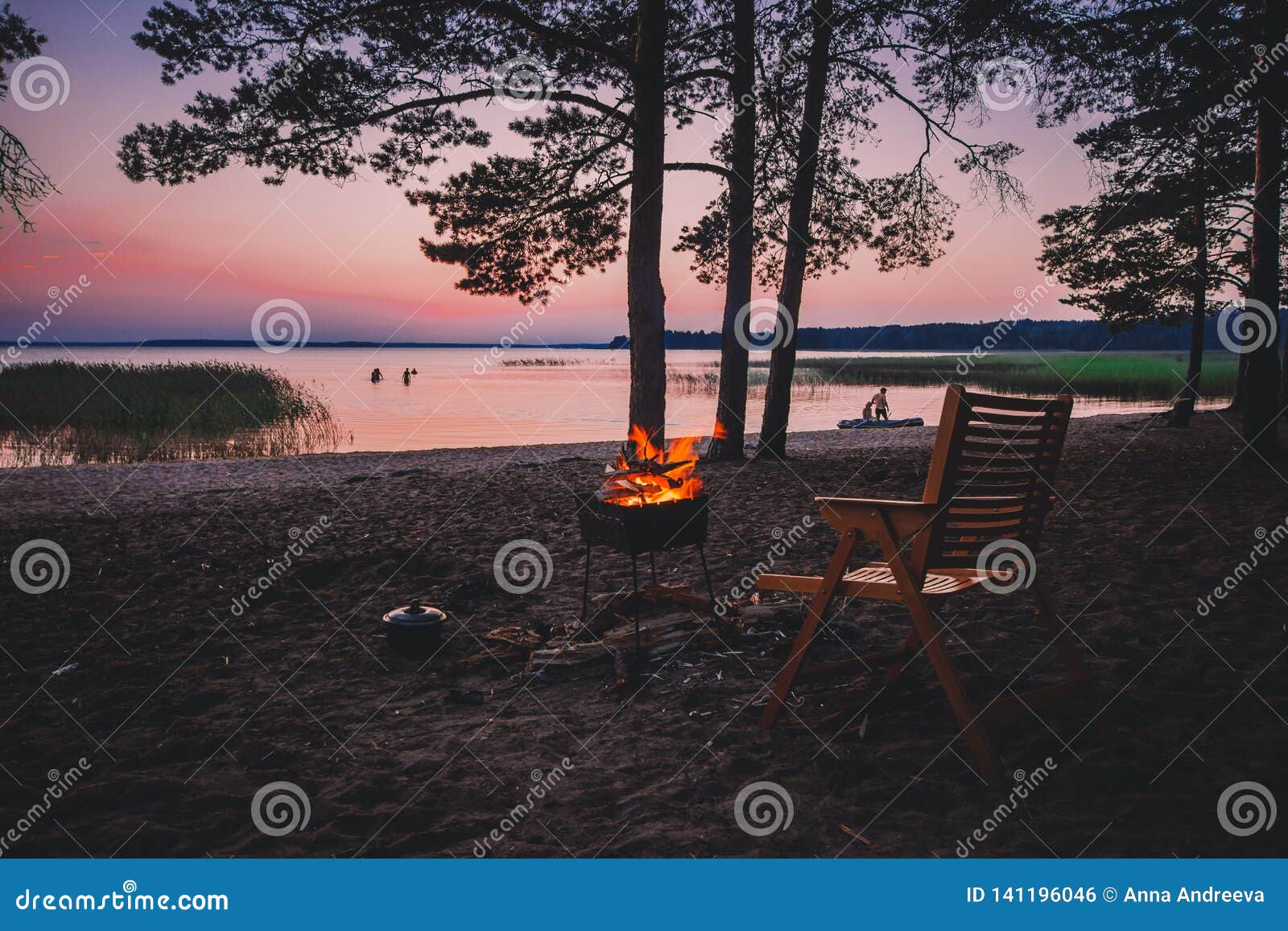 Camp Fire on Sandy Beach, beside Lake at Sunset. Stock Photo - Image of ...