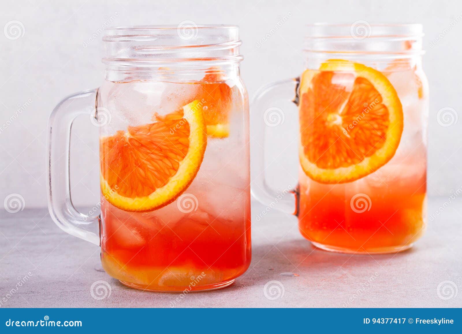 Campari and Vermouth Cocktail with Oranges, Garnished with Thyme. Stock ...