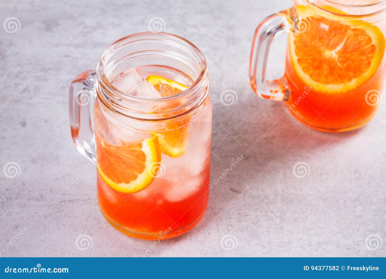 Campari and Vermouth Cocktail with Oranges, Garnished with Thyme. Stock ...