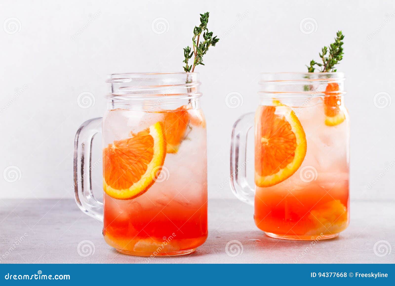 Campari and Vermouth Cocktail with Oranges, Garnished with Thyme. Stock ...