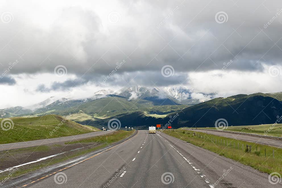 Camper on overcast highway stock photo. Image of distant - 10071274