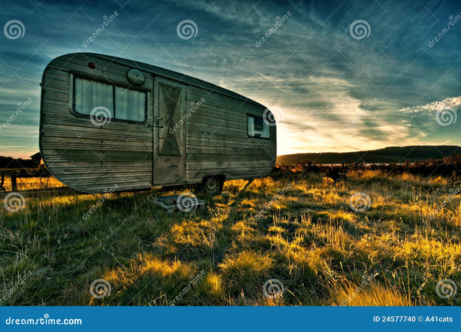 Camper Trailer Backlit by the Sun Stock Photo - Image of meadow, camper ...