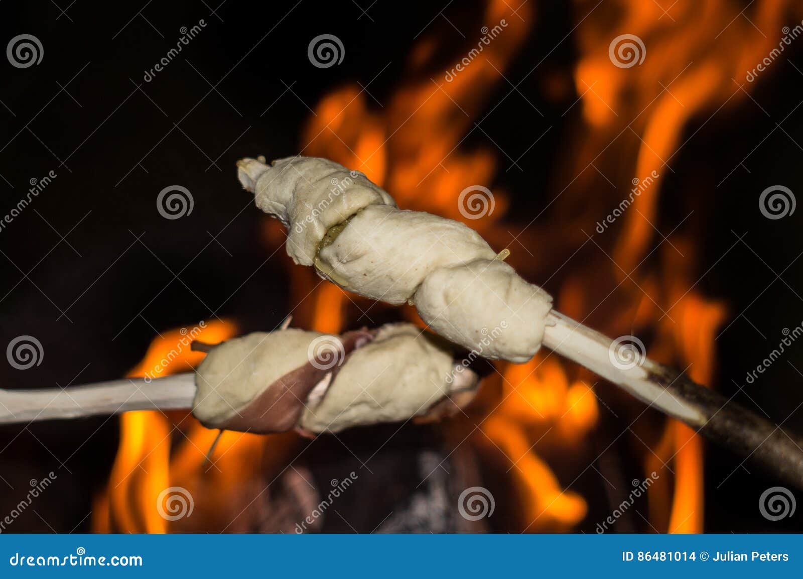 Campfire Bread on Stick in Fire Stock Photo - Image of food, knead ...