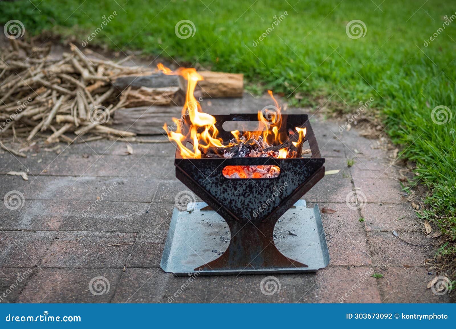 Campfire, Fire Pit Filled with Burnt Wood and Flames. Chopped Fire Wood ...