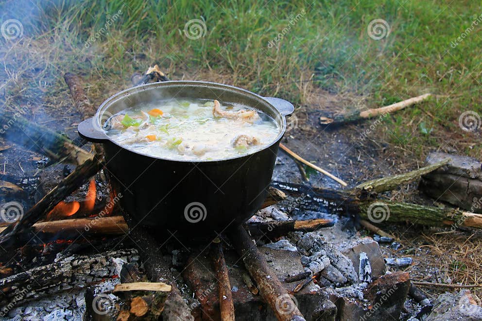 Campfire Fish Stew Cooking in a Cauldron Over an Open Fire Stock Photo ...