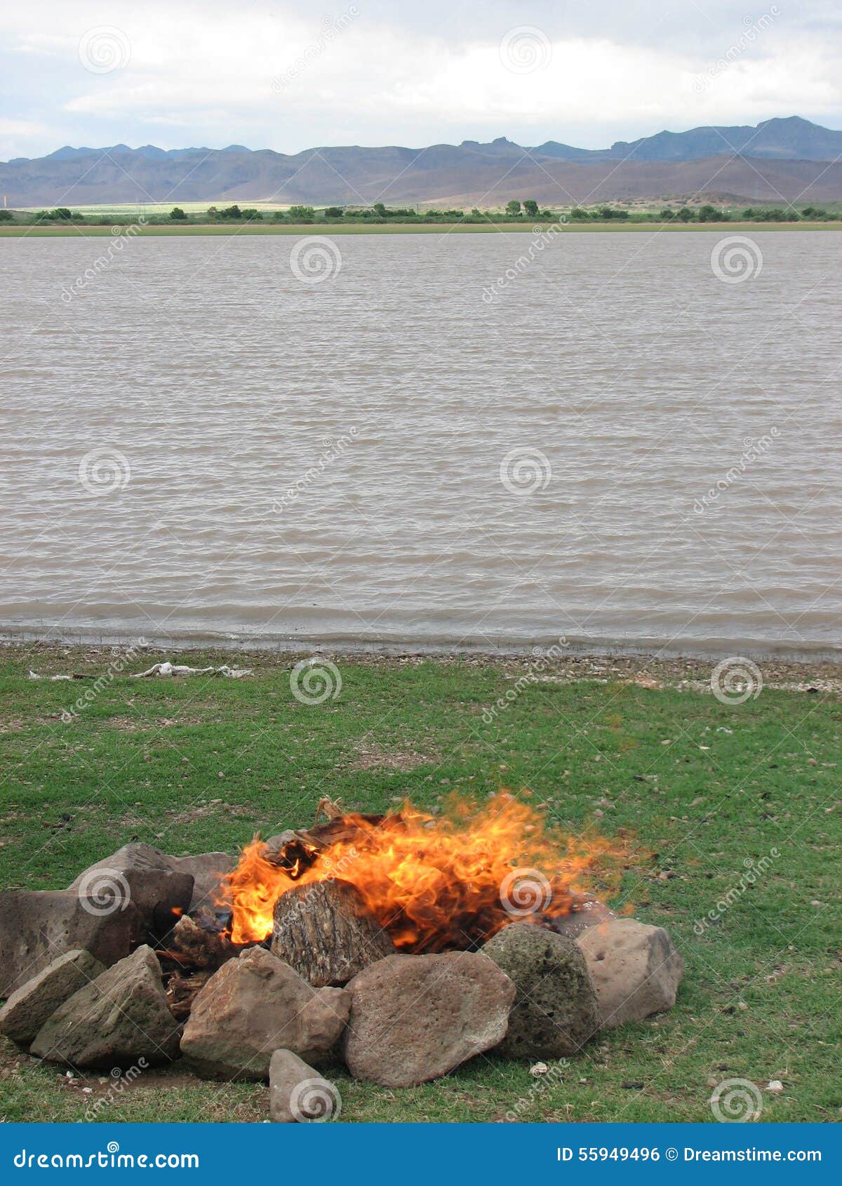 Campfire by the lake stock photo. Image of cookout, scenery - 55949496