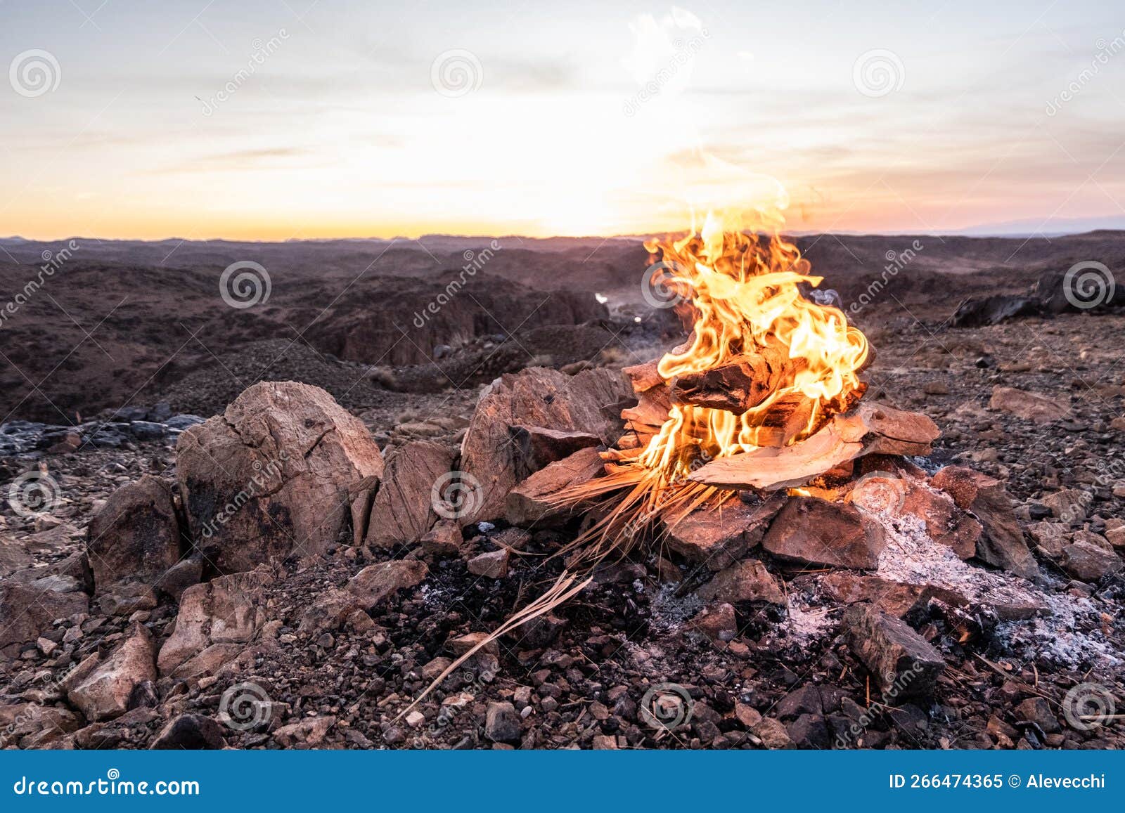 A Campfire Lit on the Top of a Mountain with the Desert As a Backdrop ...