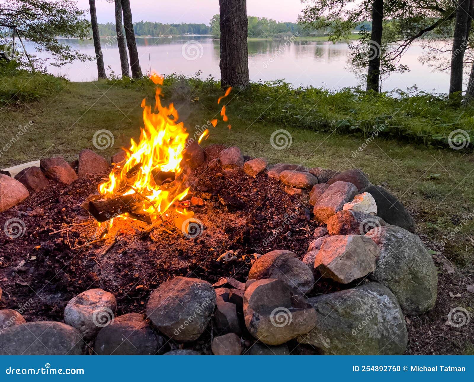 Campfire Next To a Calm Lake in the Summer Stock Photo - Image of lake ...