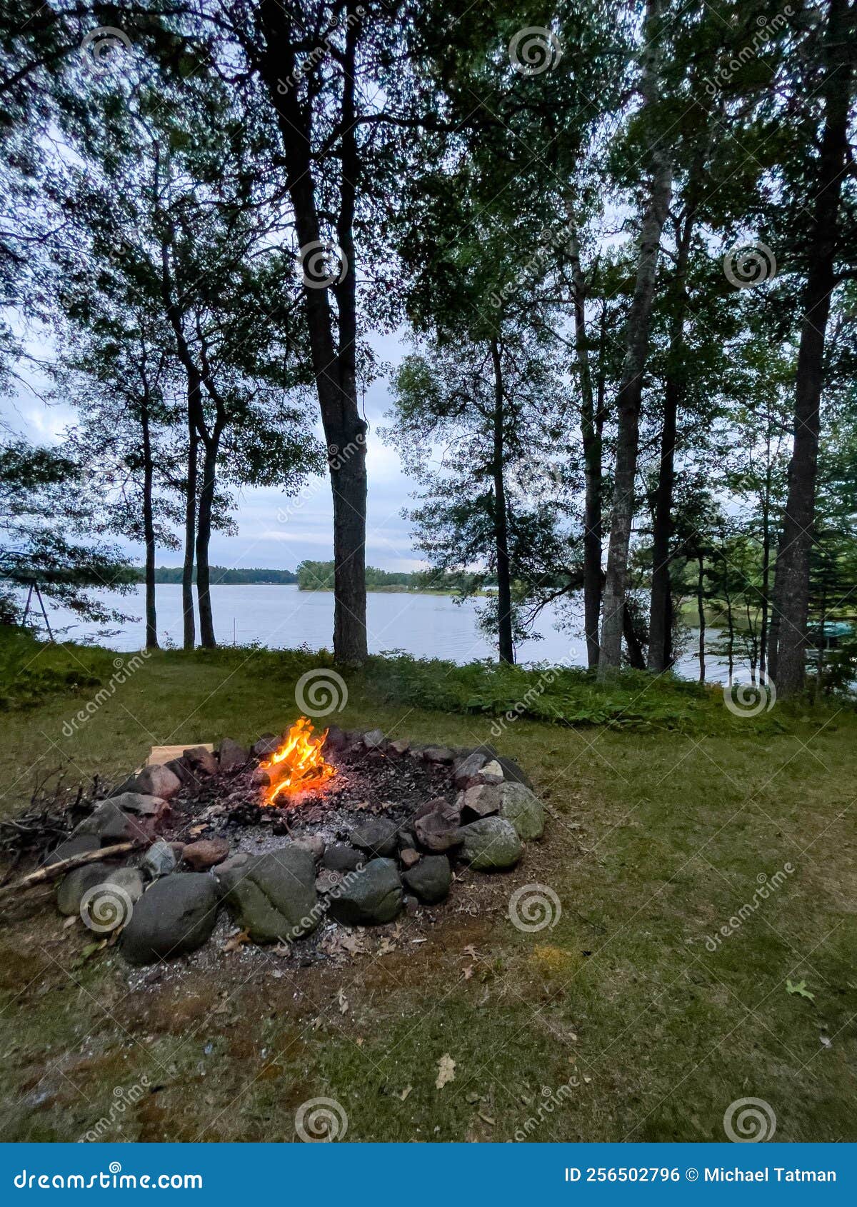 Campfire Next To a Calm Lake in the Summer Stock Photo - Image of ...
