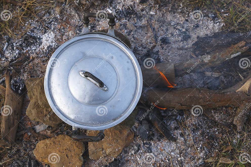 Campfire pot boiling stock photo. Image of dinner, burn - 29304282