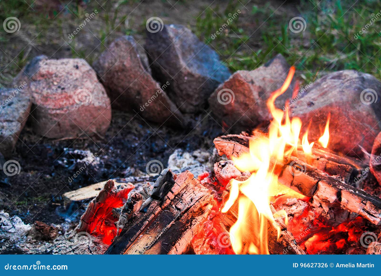A Campfire with a Ring of Stones Around it Stock Photo - Image of ...