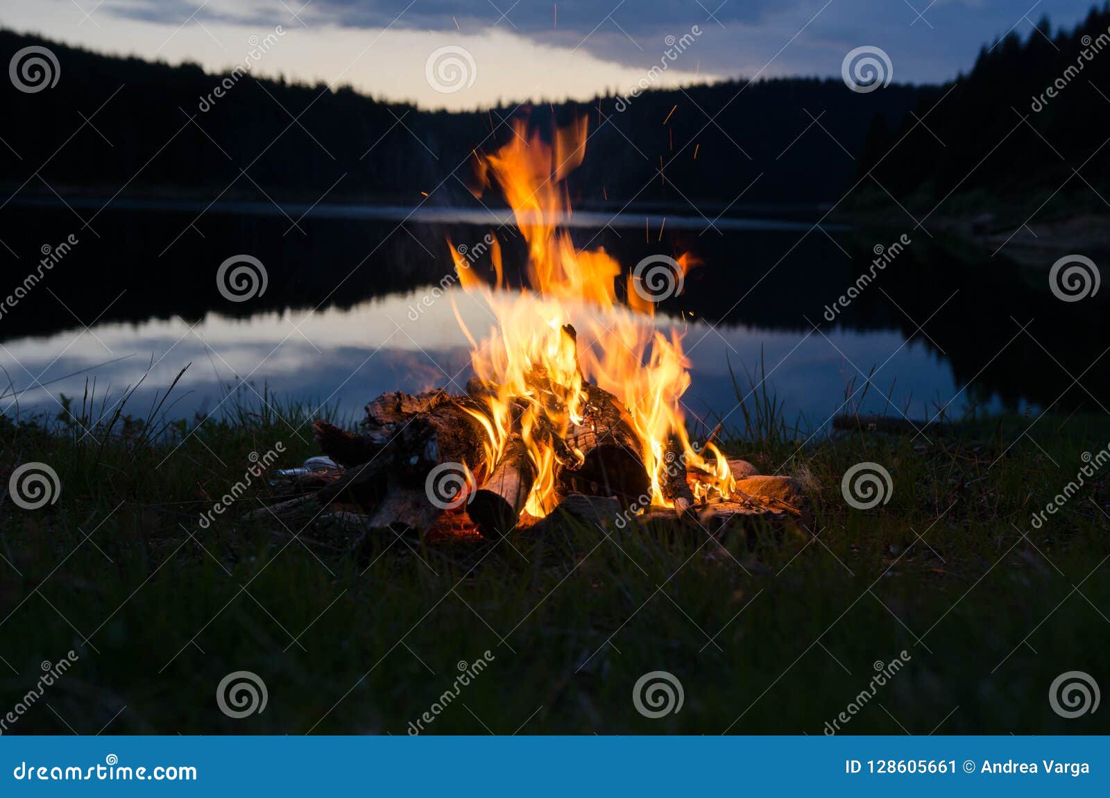 Campfire after Sunset in the Mountains Next To a Lake Stock Image ...