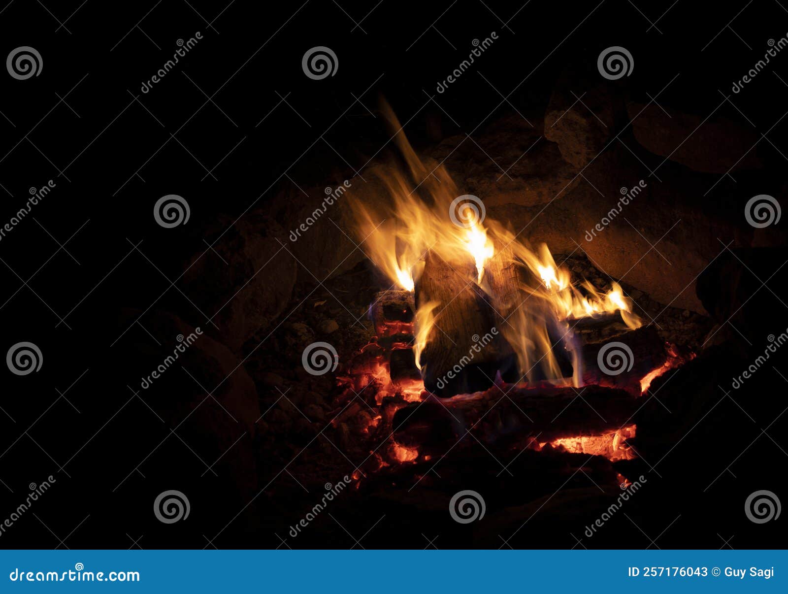 Campfire on a windy night stock image. Image of coals - 257176043