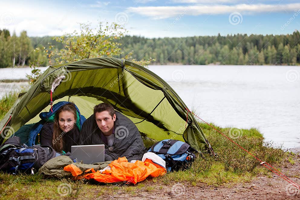 Camping with Laptop by Lake Stock Photo - Image of camping, nature ...