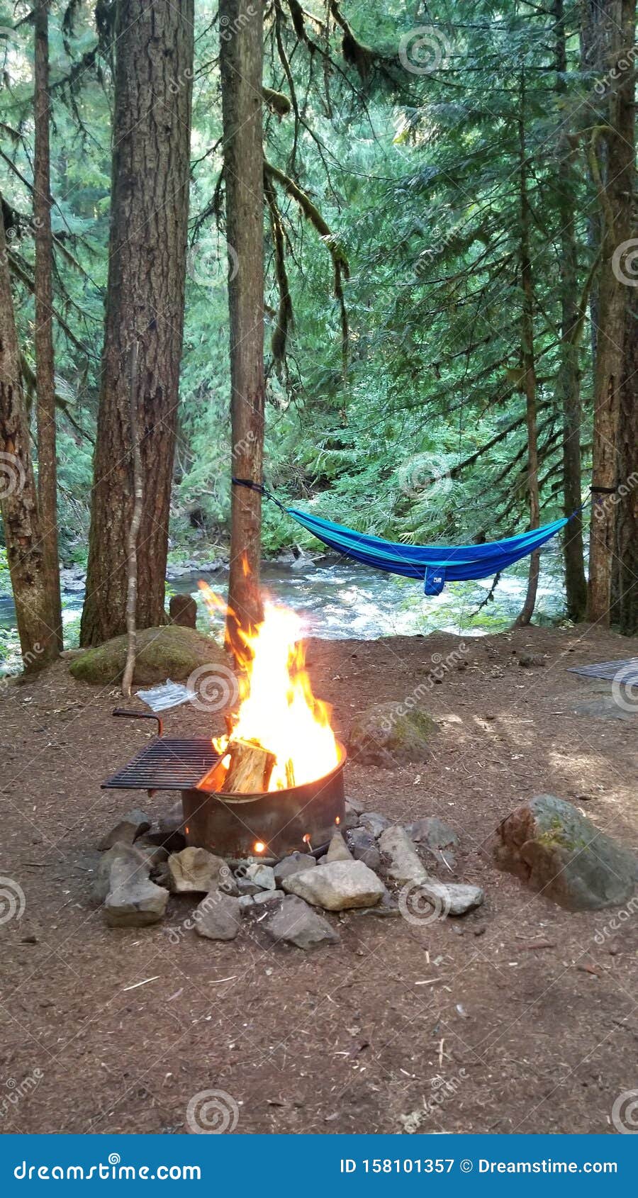 Camping Scene with fire stock image. Image of fire, creek - 158101357