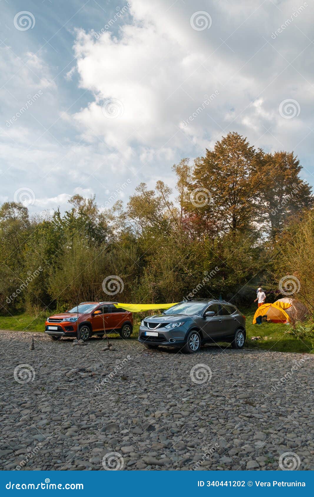 Camping Setup by the Riverbank with Cars Stock Photo - Image of travel ...