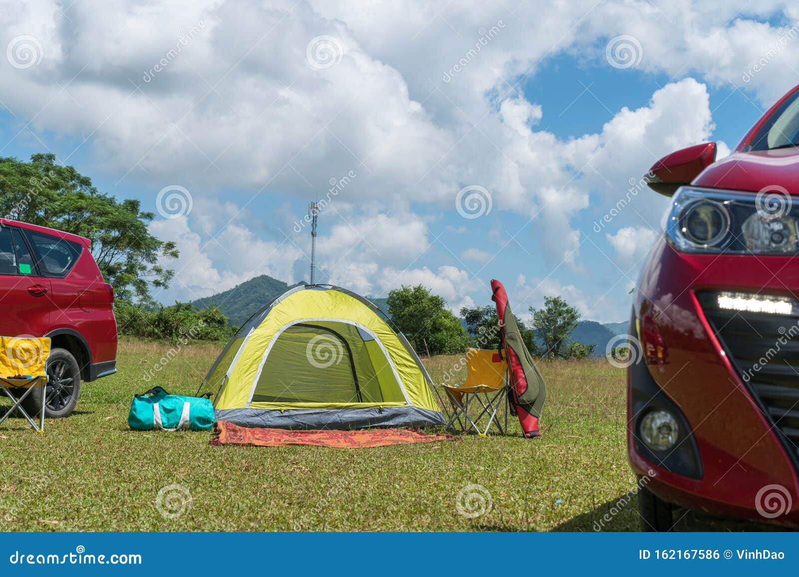 Camping Site on Grass Field with Tent and Car beside Tent. Leisure ...