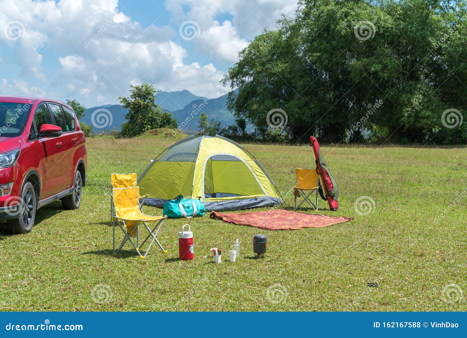 Camping Site on Grass Field with Tent and Car beside Tent. Leisure ...