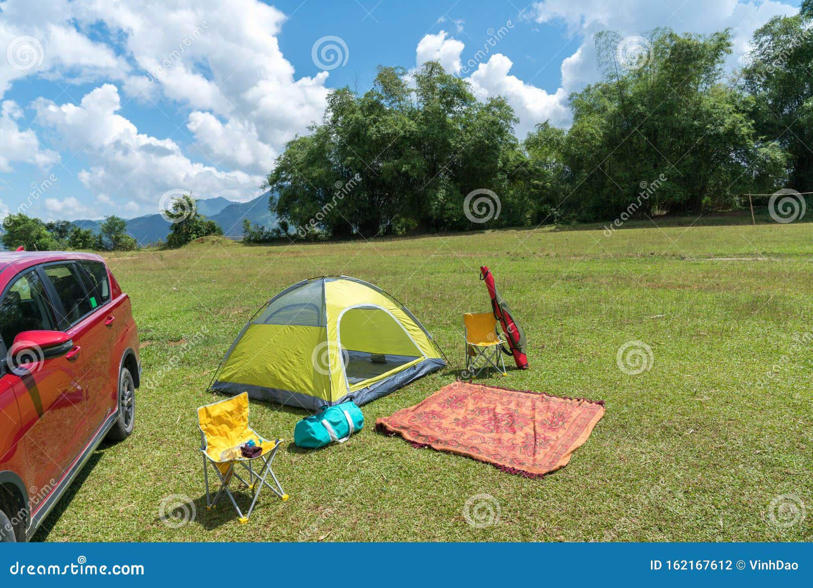 Camping Site on Grass Field with Tent and Car beside Tent. Leisure ...
