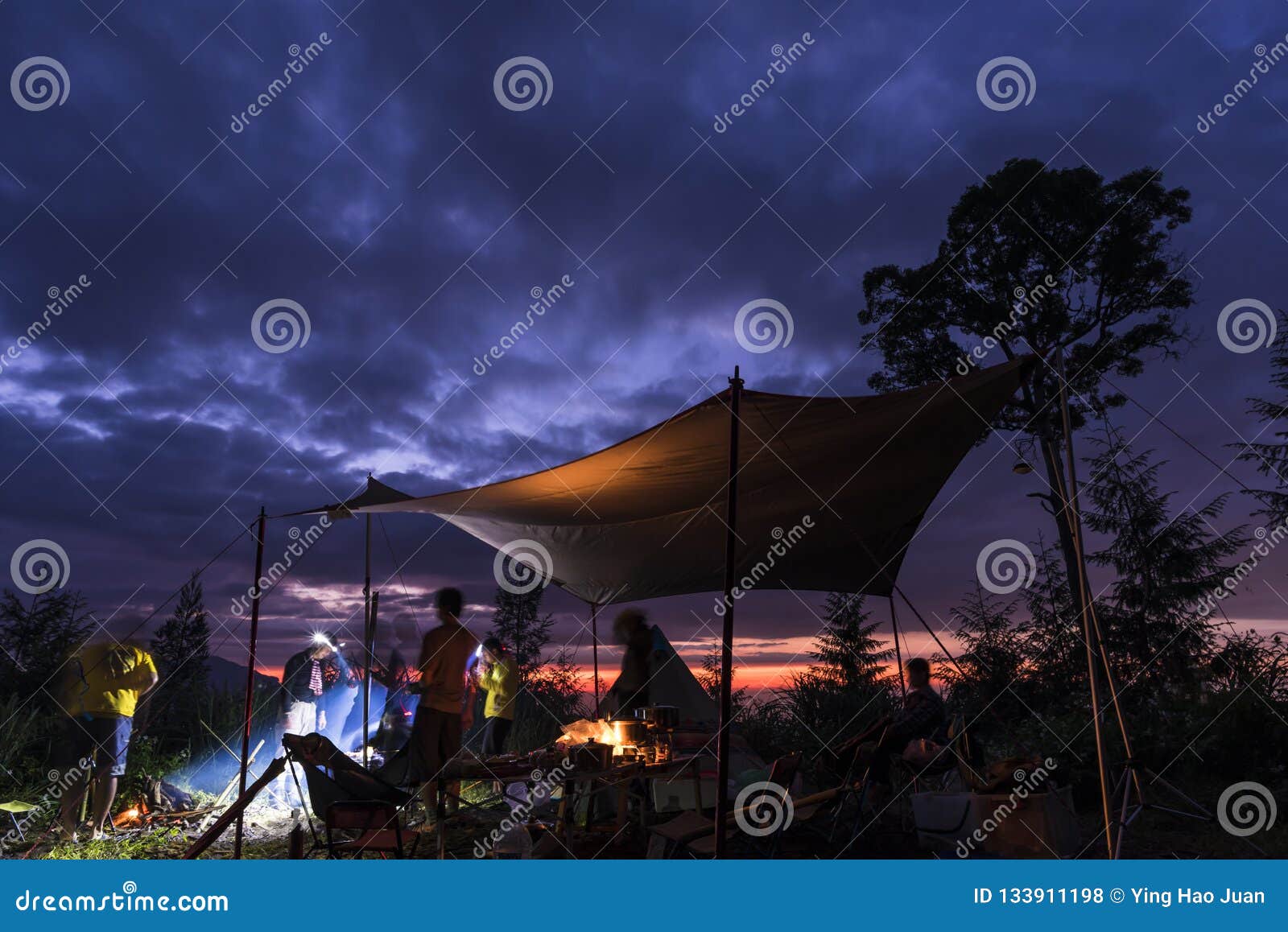 Camping in the sunset stock photo. Image of cloudy, sunset - 133911198