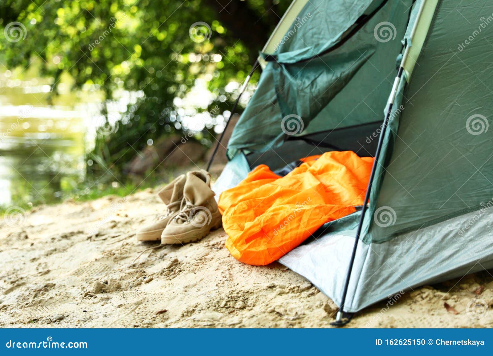 Camping Tent with Sleeping Bag and Boots Stock Photo - Image of ...