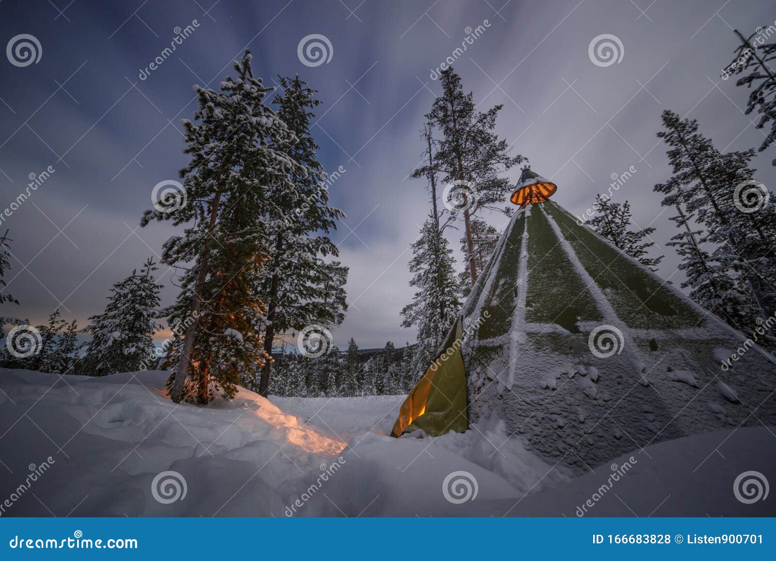 Camping Tent in the Snow Forest with Fire Light in a Cold Winter in ...