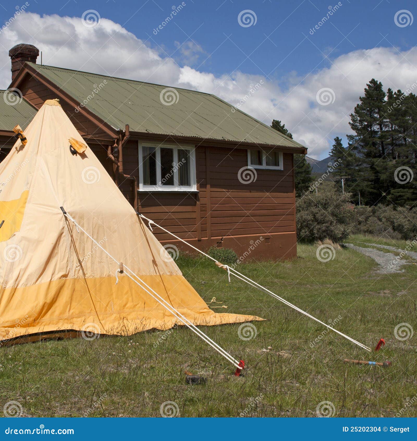 Camping Tent and Wooden Hut in the Mountains Stock Photo - Image of ...
