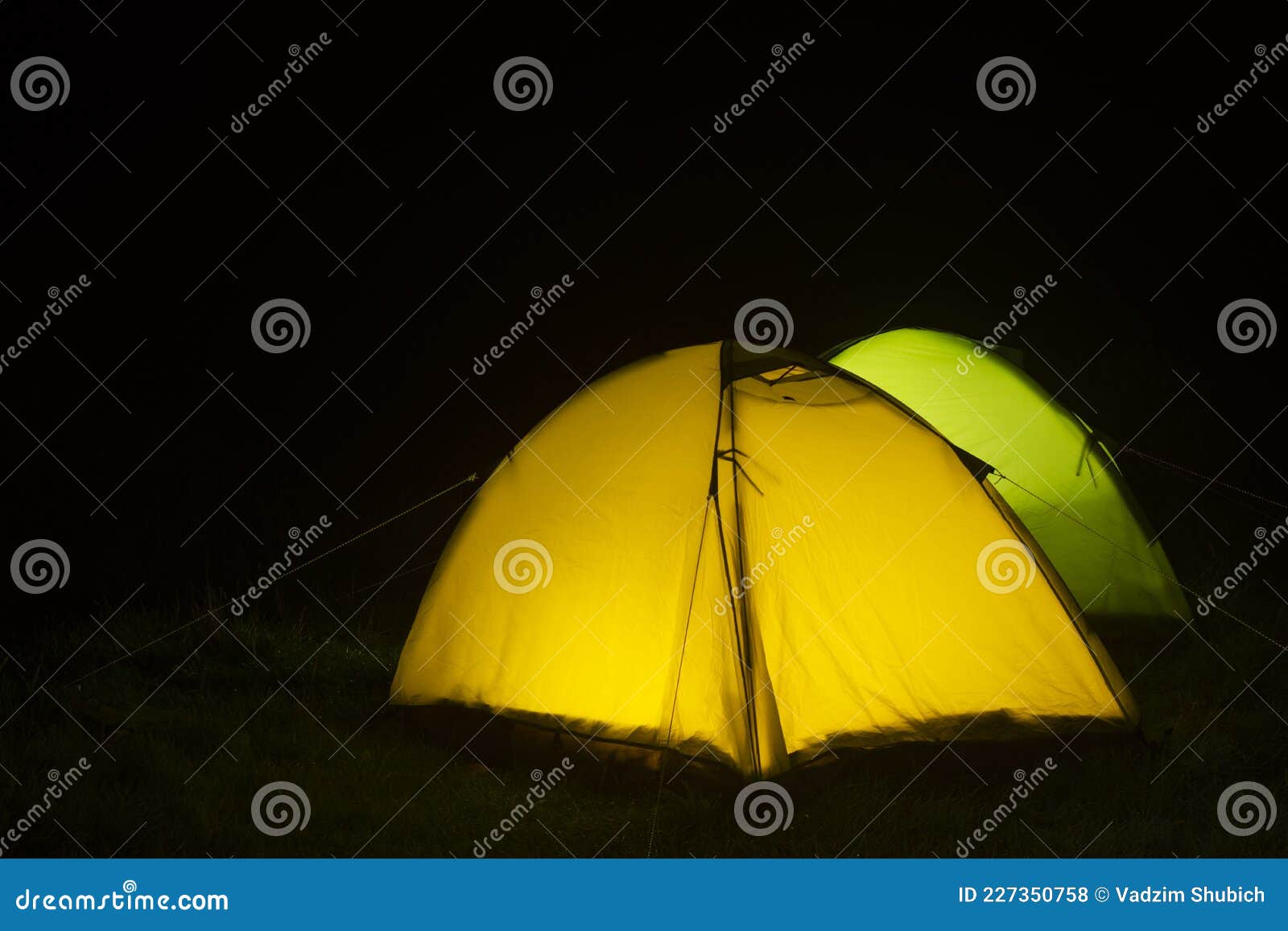 Camping Tents at Night in Nature Glow Inside Stock Photo - Image of ...