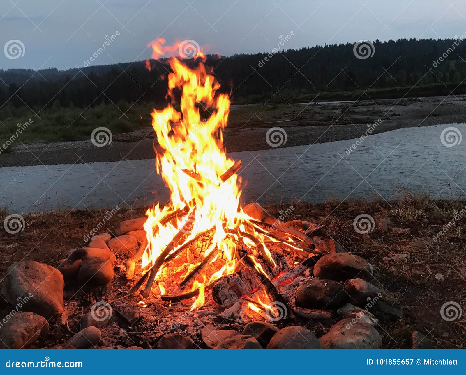 Campfire in front of river stock image. Image of relaxation - 101855657