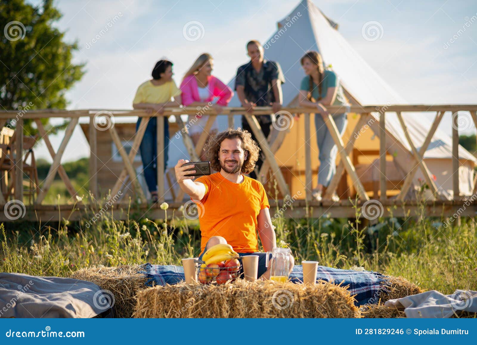 At the Campsite Great Looking Man Looking Over His Smartphone while ...