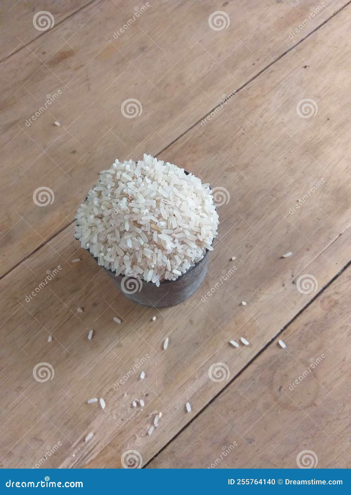 A Can Full of Rice Grains on the Wooden Table Stock Photo - Image of ...