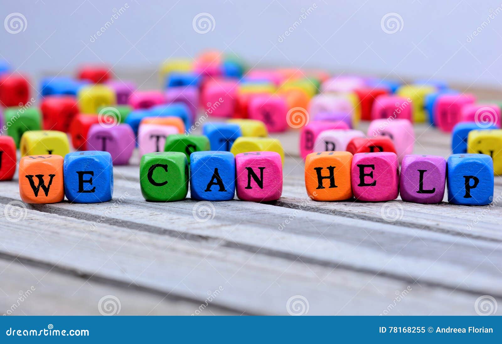 We can help words on table stock image. Image of closeup - 78168255