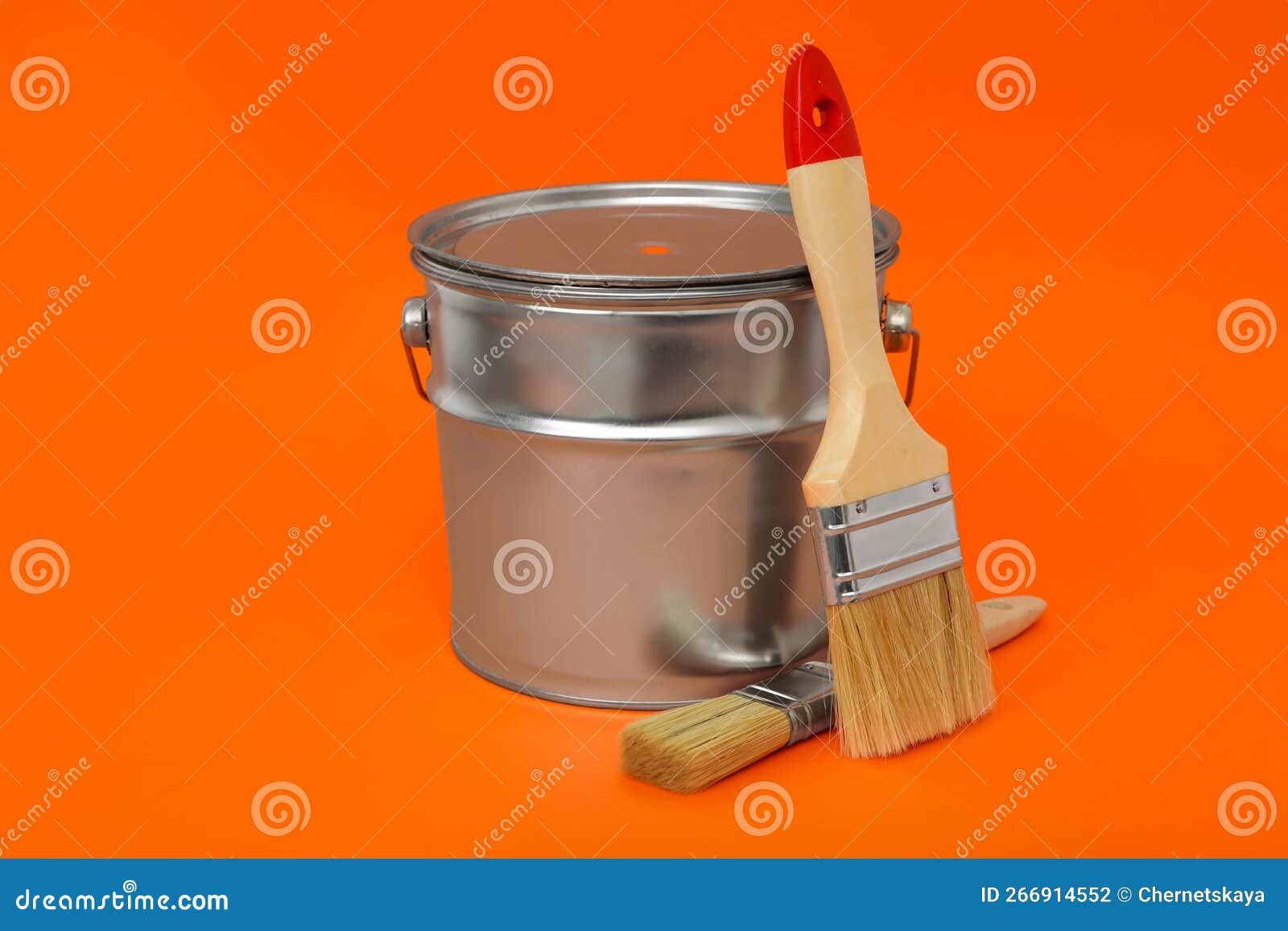 Can of Orange Paint and Brushes on Color Background Stock Photo - Image ...