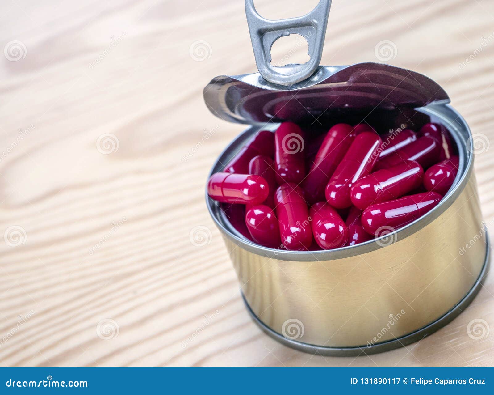 Can with red capsules stock image. Image of business - 131890117