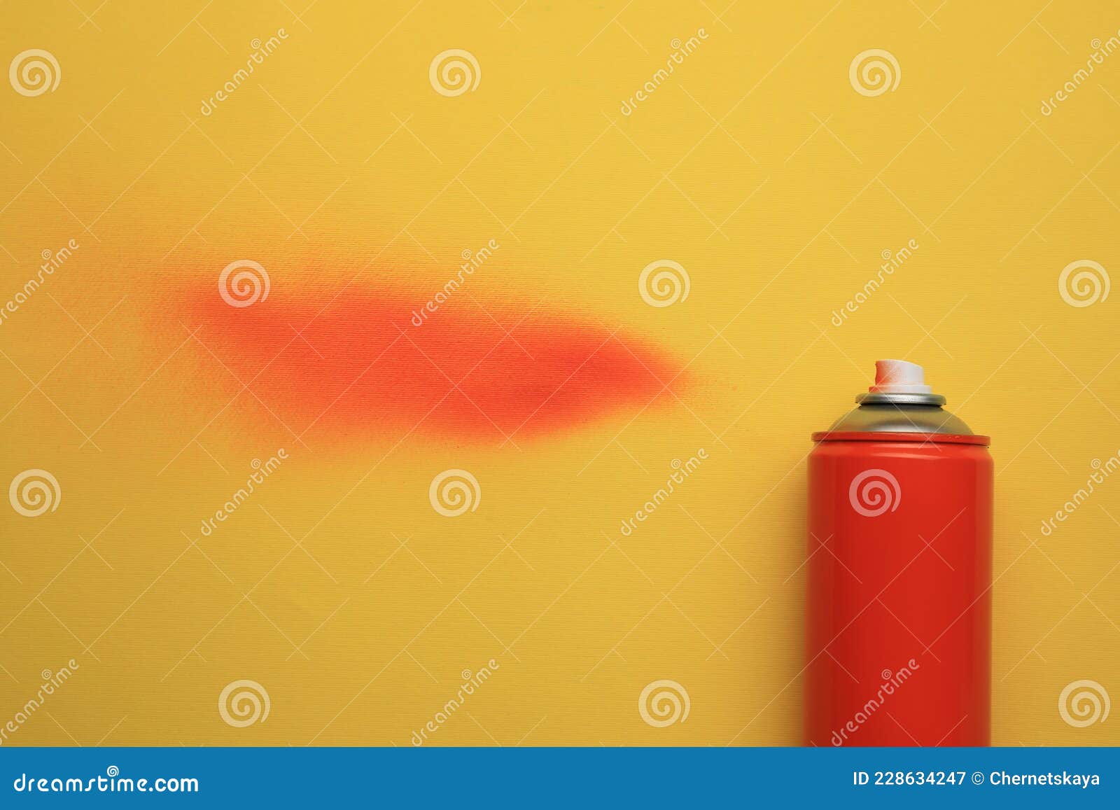 Can of Red Graffiti Paint and Sprayed Dye Sample on Yellow Background ...
